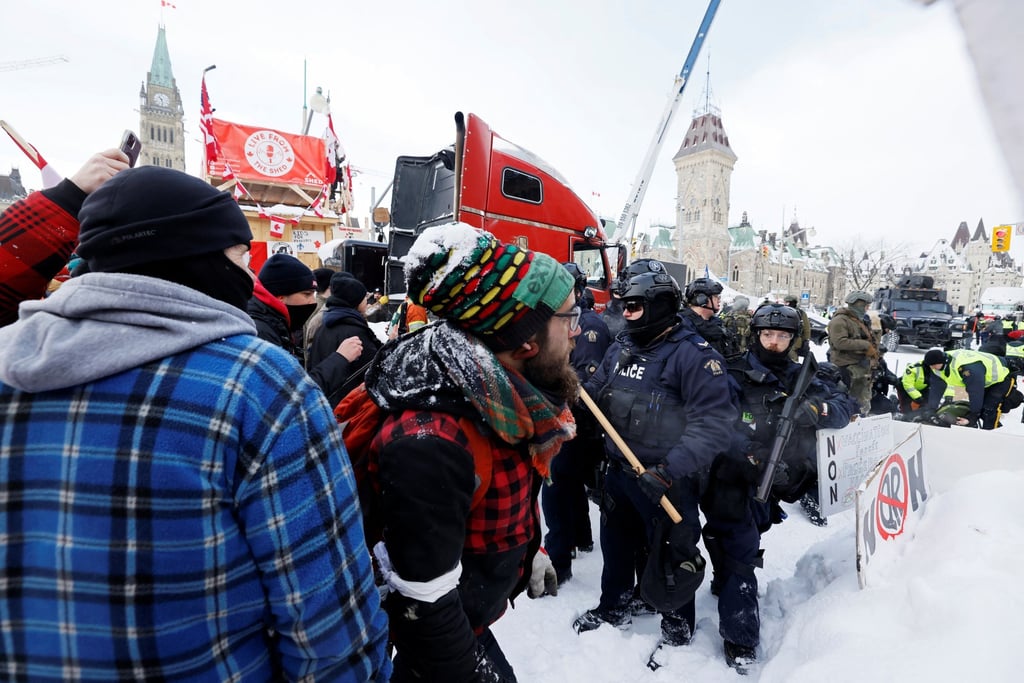 Canadian police in riot gear clear main protest hub in Ottawa as ...