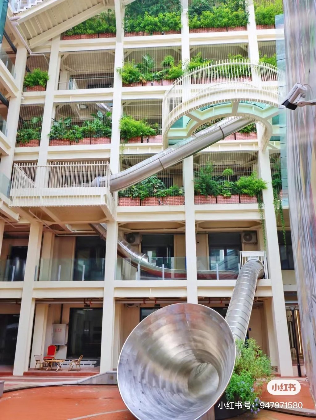 You think your office is fun? This building in China features slides ...