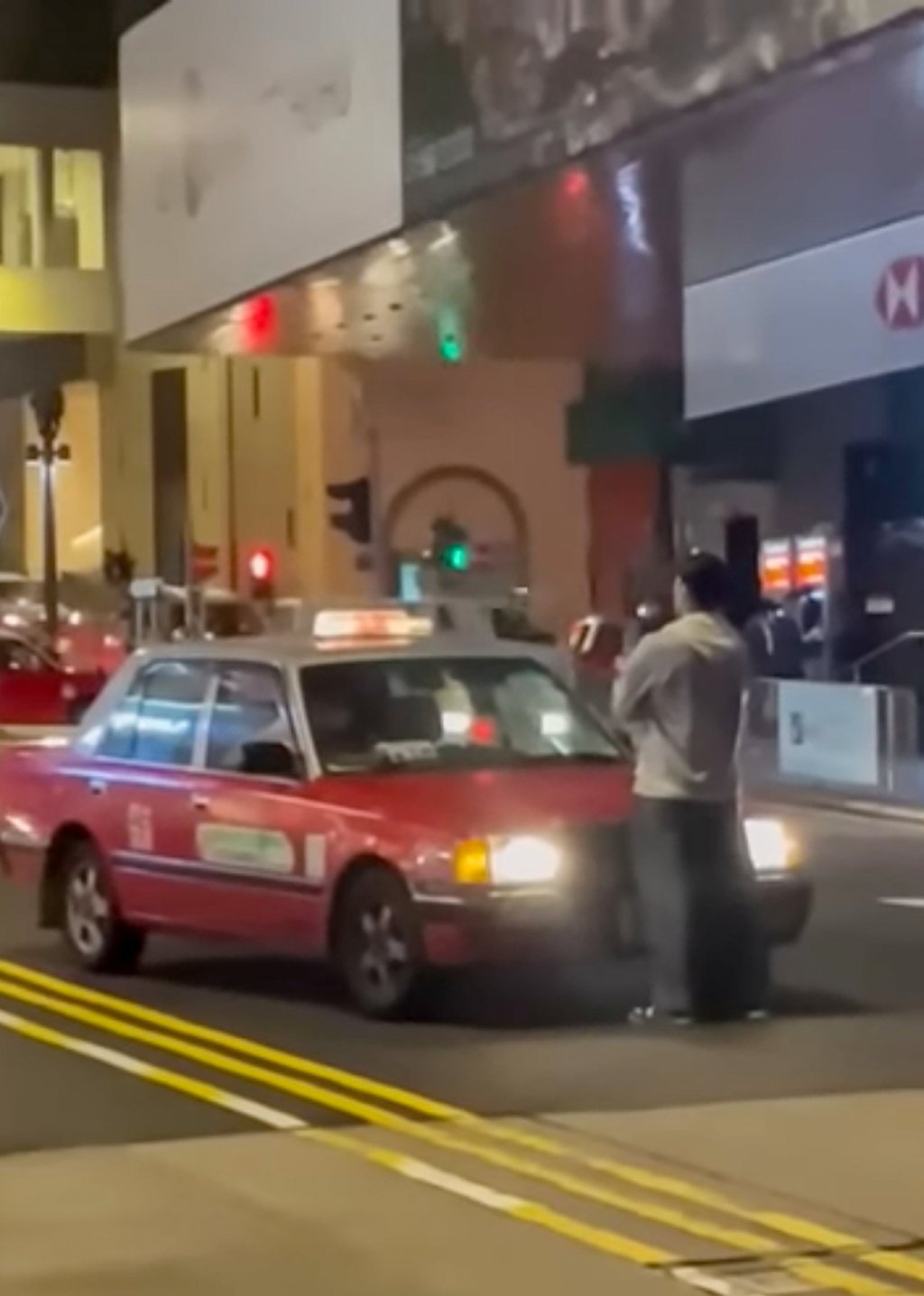 Hong Kong road rage video showing man clinging to reversing taxi goes ... Hong Kong road rage video showing man clinging to reversing taxi goes ...