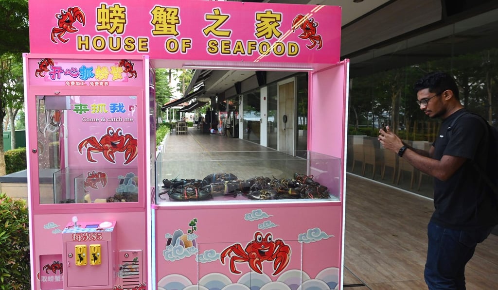 Grab-a-crab? Anger at Singapore restaurant’s arcade-style claw machine ...