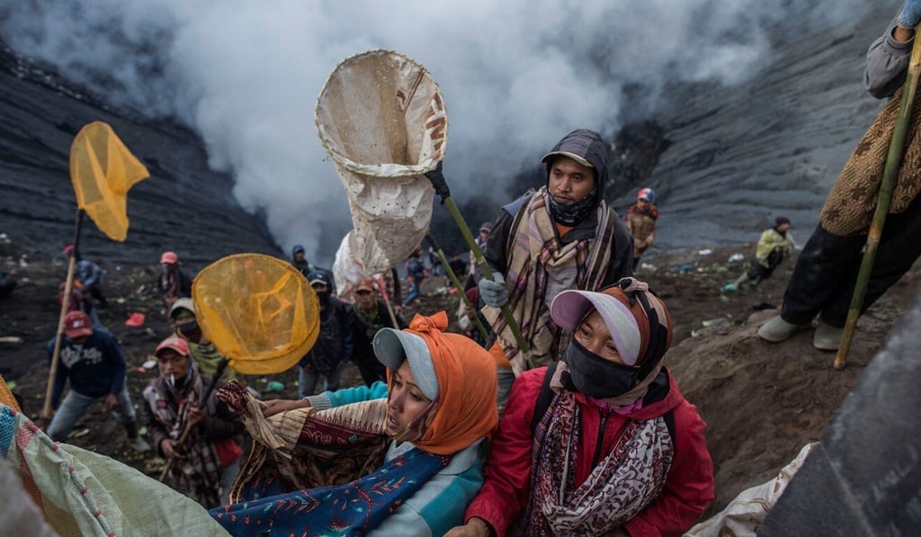 Thrown in a volcano: Indonesian devotees gather in thousands to ...