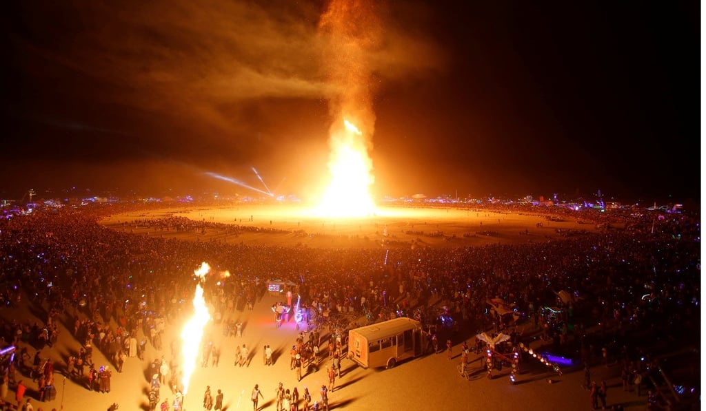 Burning Man festivalgoer dies after evading firefighters and running ...