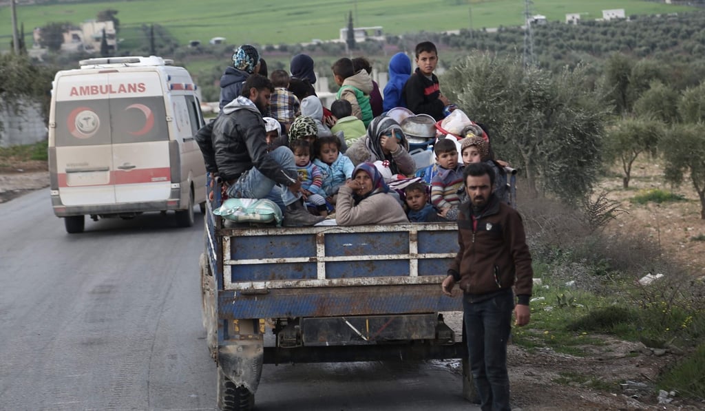 Civilians flee as Turkey says its troops have surrounded Kurdish city ...