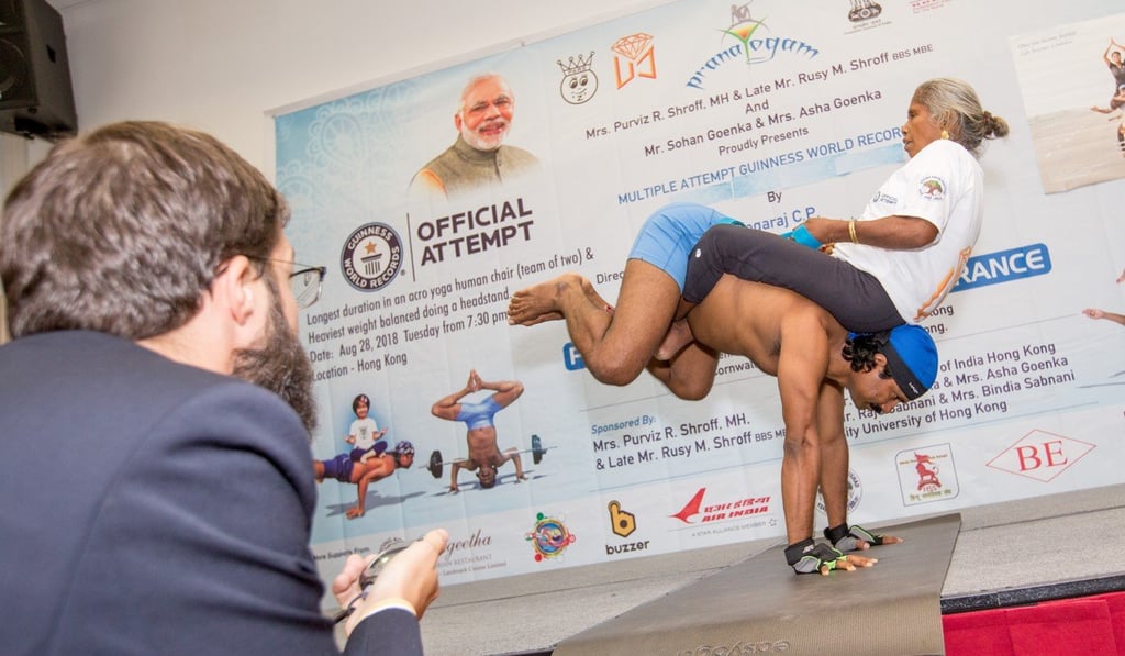 Hong Kong yogi breaks Guinness World Records for headstand and human ...
