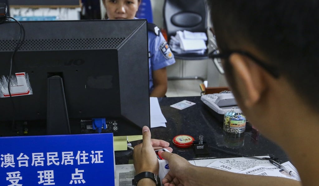 Users flaunt new ID card for Hong Kong, Macau and Taiwan residents in ...