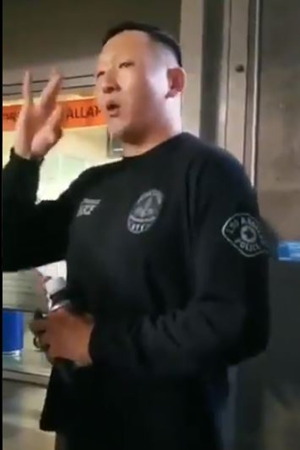 Police arrest Daniel Sohn, who wore T-shirt with LAPD logos and chanted ...