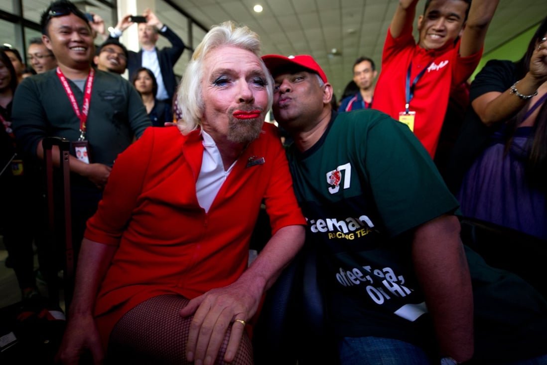 Richard Branson Serves As Airasia Stewardess After Losing Bet South