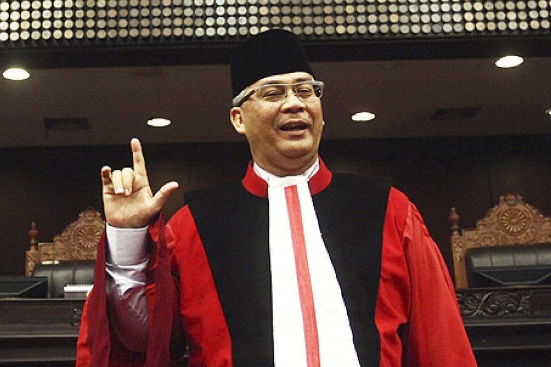 Top Indonesian judge seized in bribery probe after disputed election ...