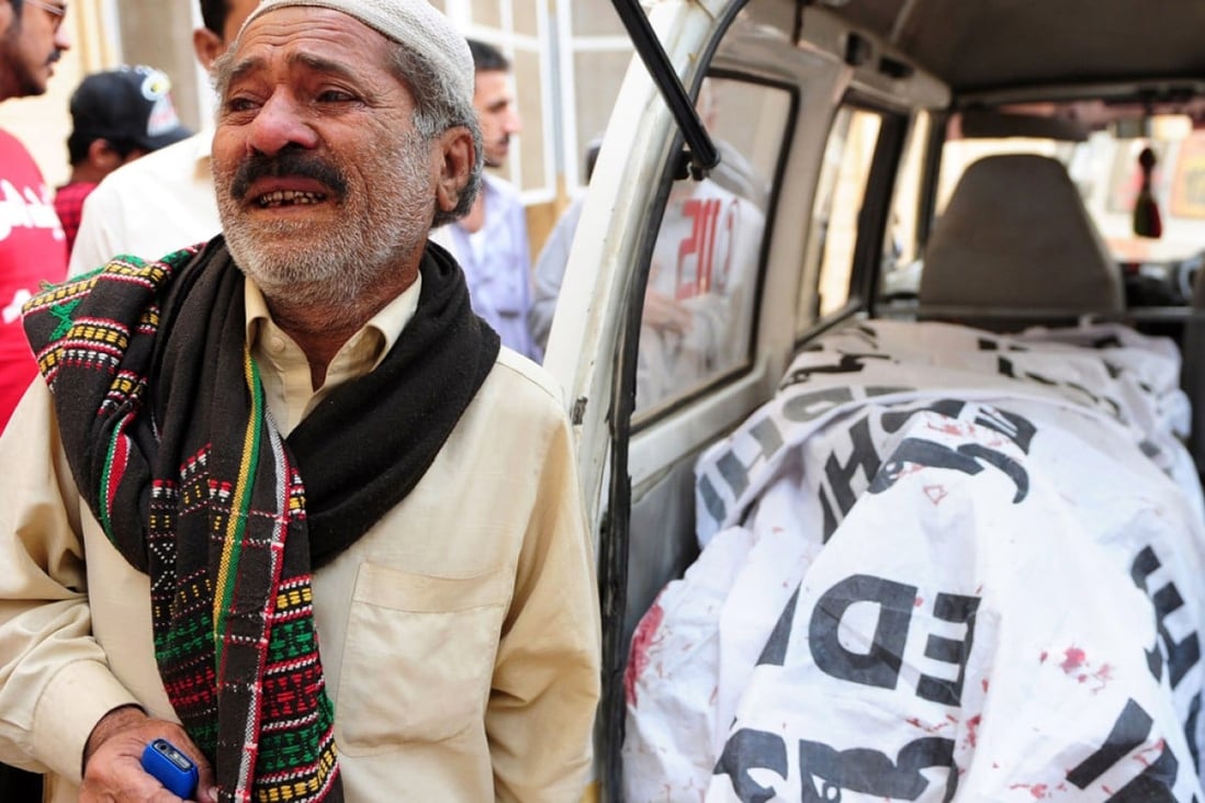 Karachi gang members kill 15 passers-by in attack outside market ...