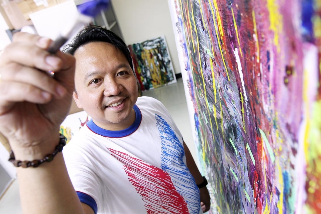 Filipino painter sells his art to raise money for typhoon victims ...