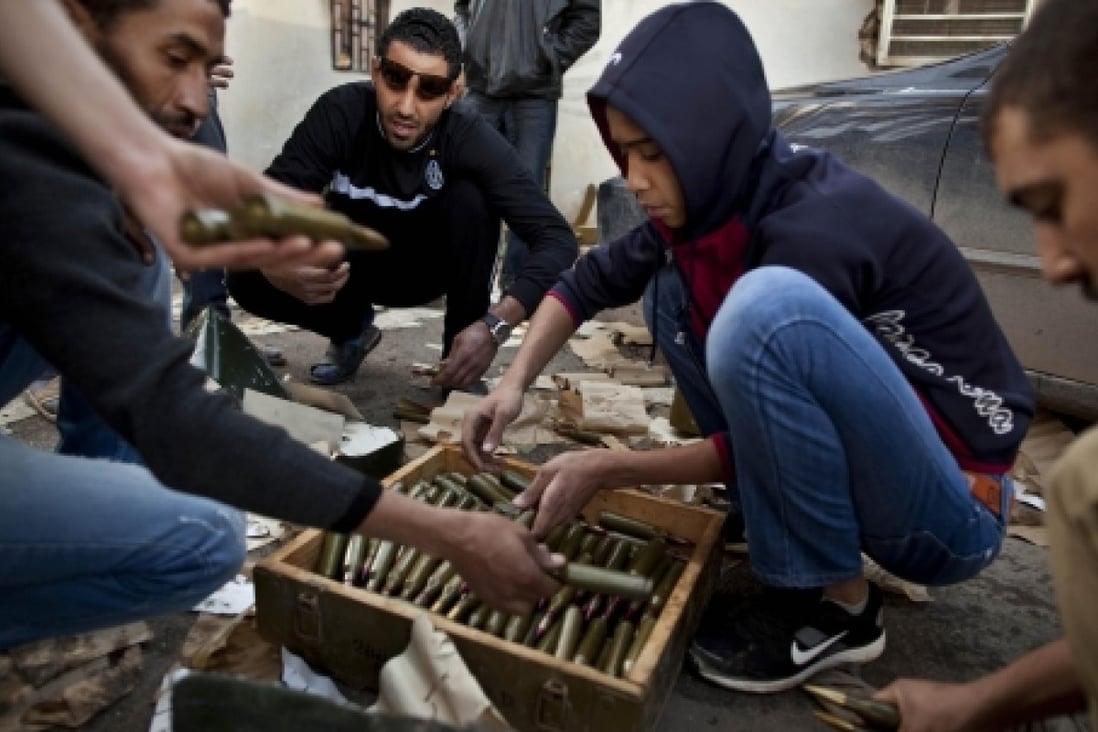 Explosions and gunfire as rival militias battle to control Libya's main ...
