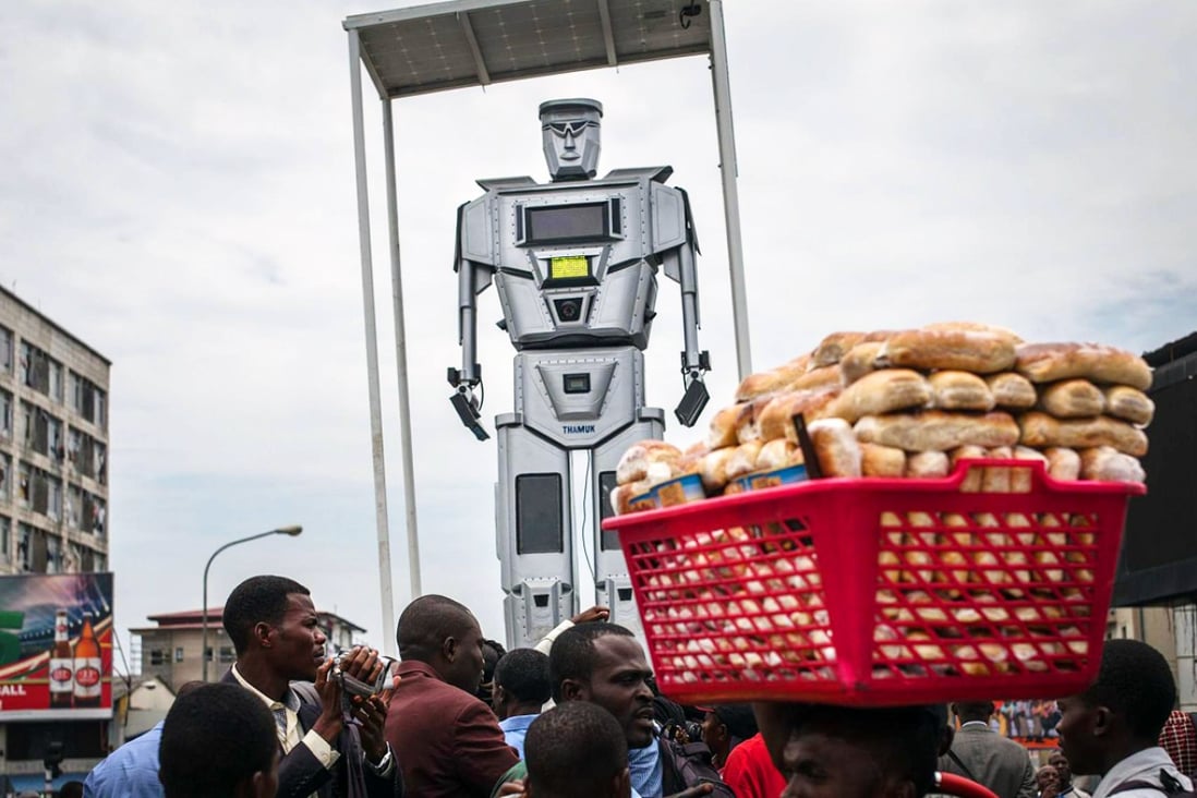 Solar-powered robocops installed to control traffic chaos on Kinshasa ...
