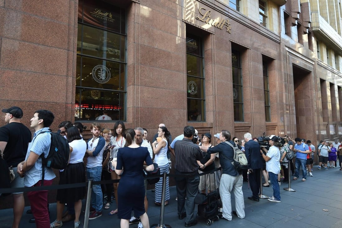 Crowds flock as Sydney's Lindt café re-opens 95 days after terror siege ...