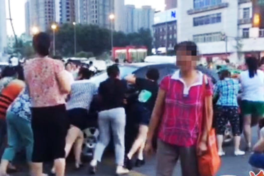 Chinese ‘dancing grannies’ muscle up to haul parked cars, van off the ...