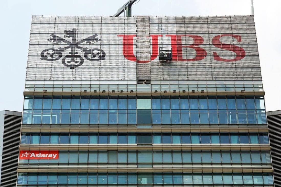 Money over renewable energy: giant UBS bank ad covers solar cells of ...
