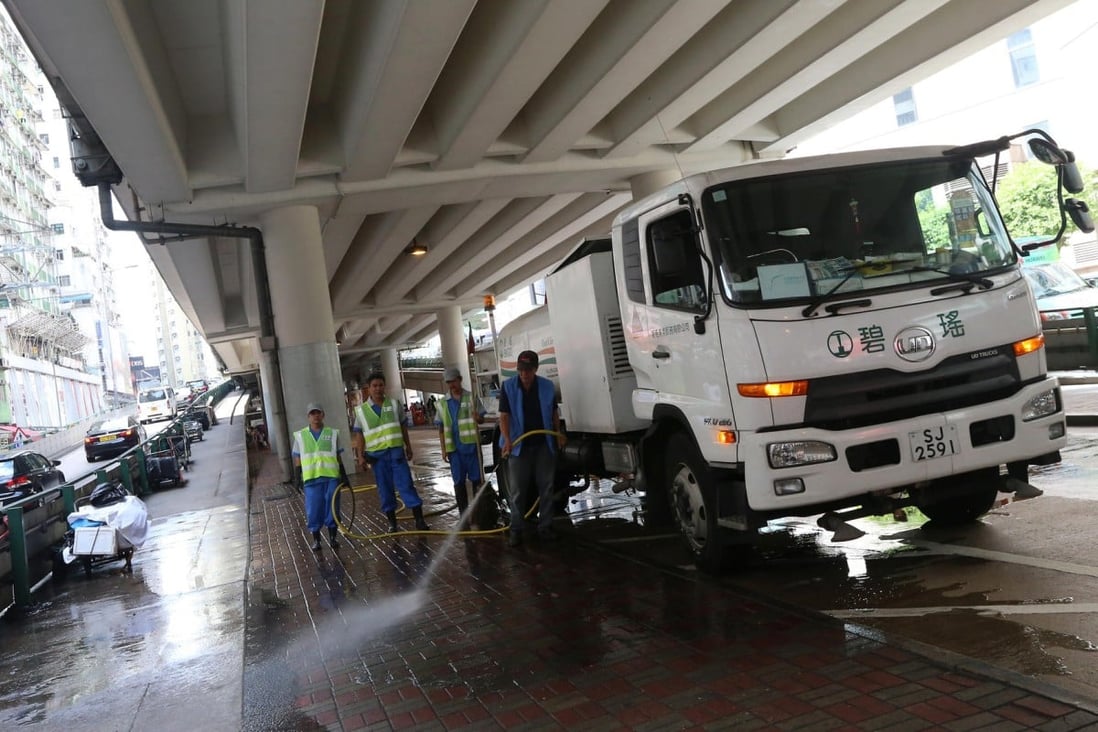 Cleaners spruce up Hong Kong streets before health minister Ko appears ...