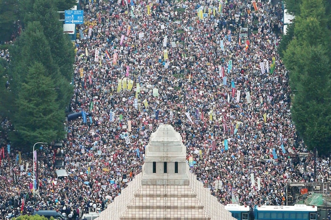 Tens of thousands protest at military bills outside Japan parliament ...