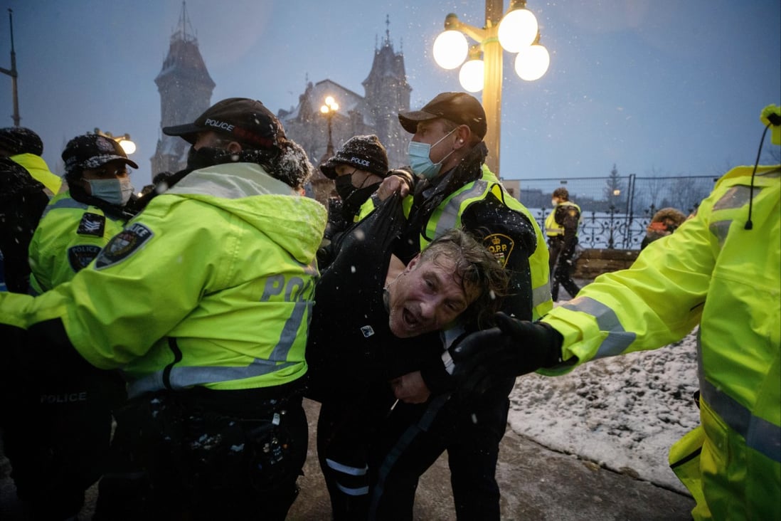 Canada police tow trucks and arrest protesters in bid to break Ottawa ...