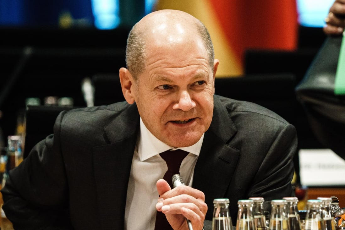German leader Olaf Scholz under scrutiny as he leads business ...