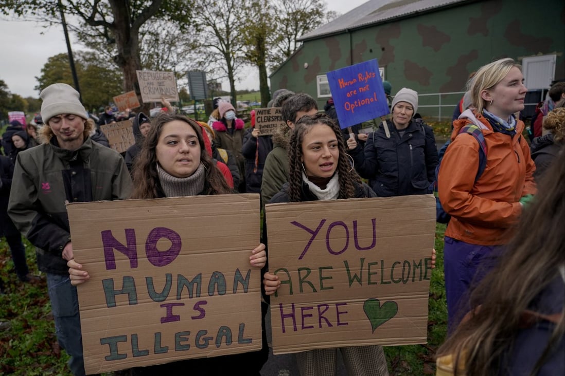 Hundreds protest outside UK migrant centre as government pledges to ...