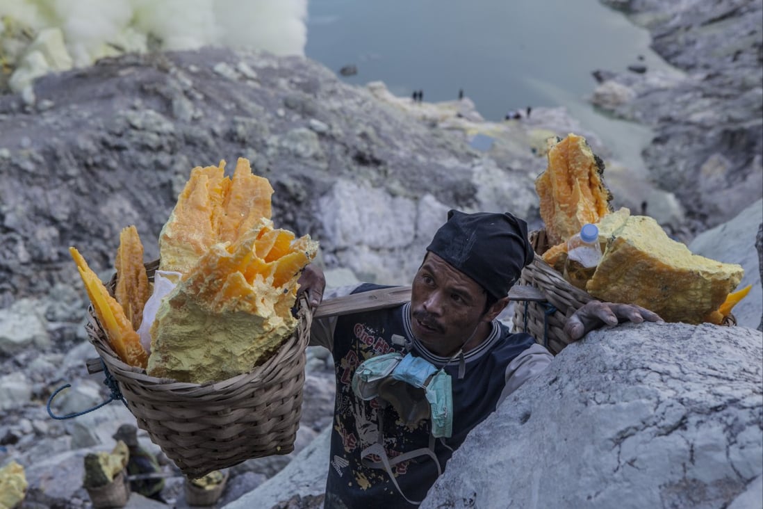 Why miners in Indonesia risk their lives to get sulphur from inside an ...