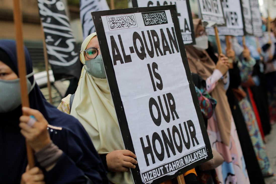 Malaysian Muslims take to streets to protest Koran burning in Sweden by ...