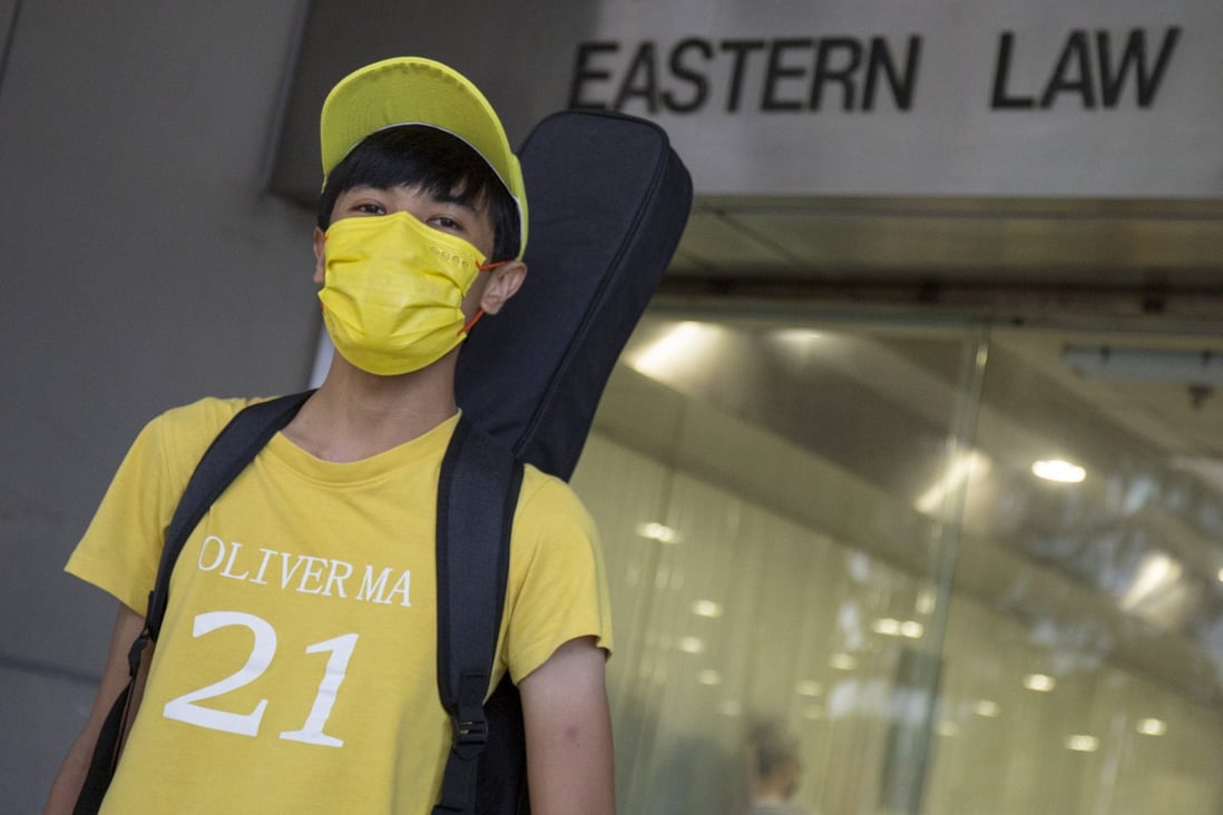 Hong Kong busker arrested while playing protest song cleared of Covid ...