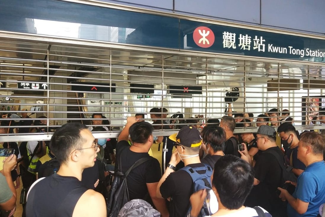 Angry residents confront Hong Kong’s MTR staff over closure of train ...