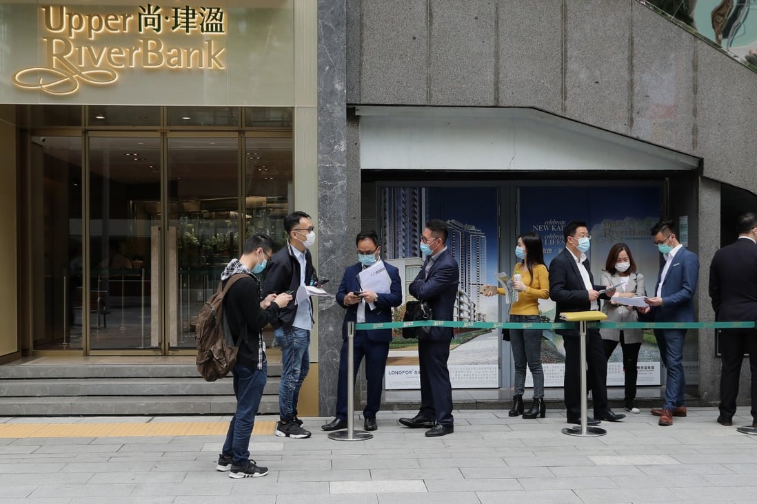 Hong Kong developers scale back project launches, slow down ...