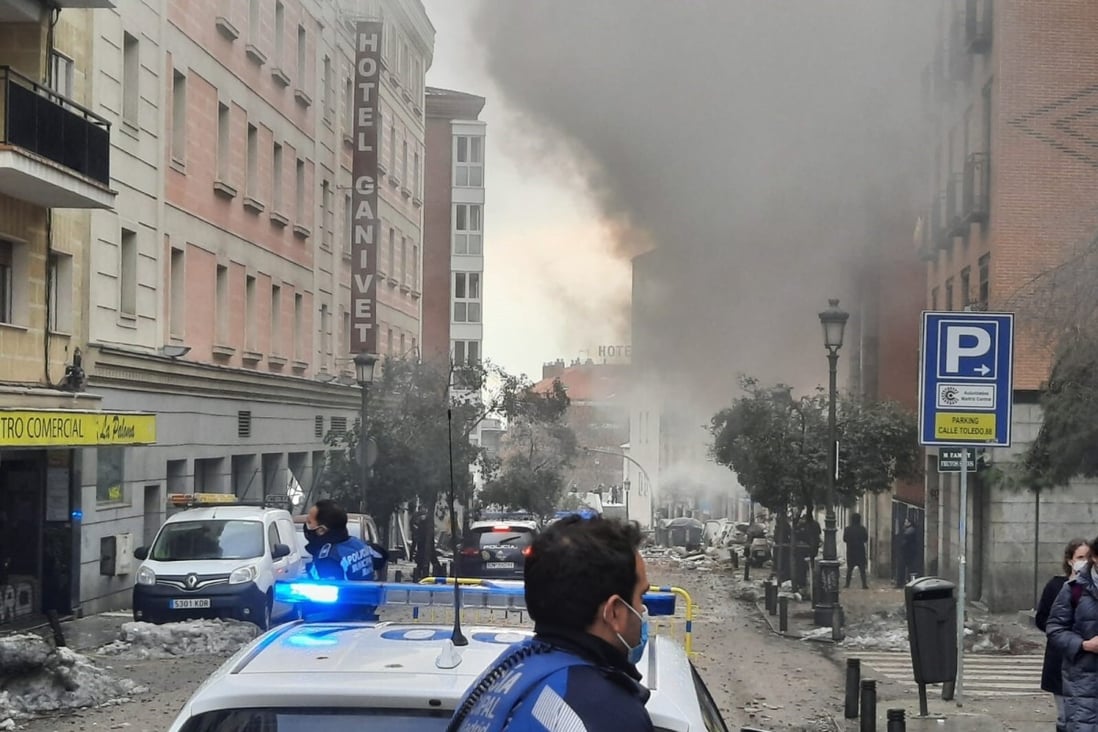At least three people dead after explosion brings down building in ...