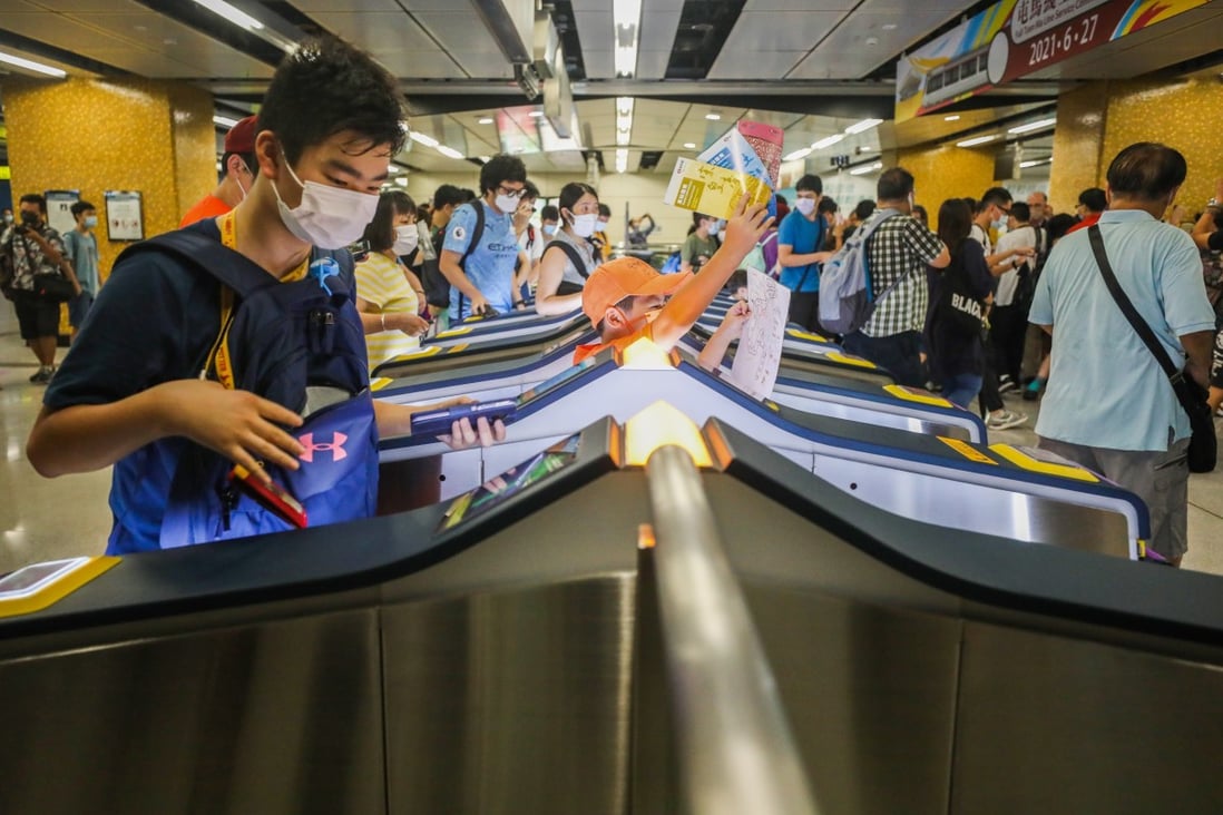Hong Kong train fans queue before dawn for first rides on long-delayed ...