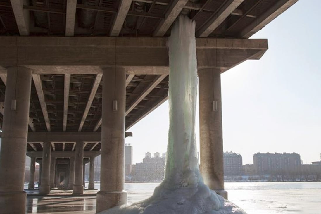 Big freeze: dripping pipe creates huge ice pillar in China’s frozen ...