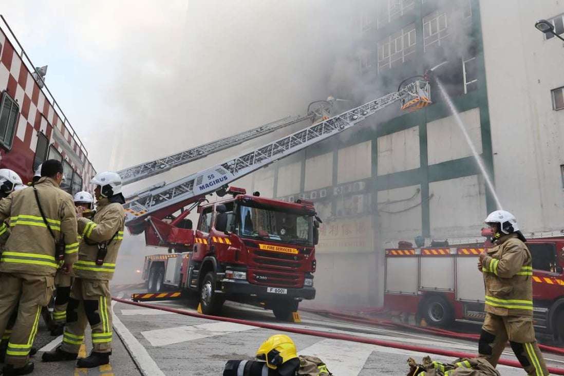 Battling exhaustion, Hong Kong firefighters continue to combat deadly ...