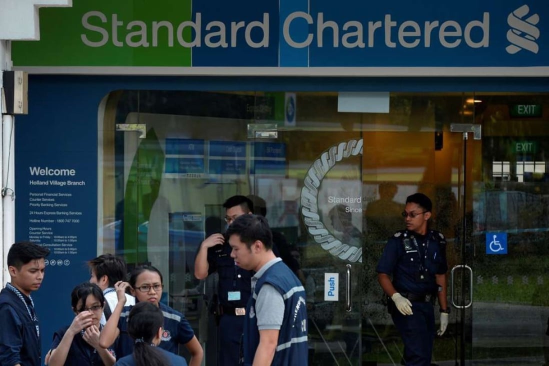 Canadian man who robbed Singapore bank with 'note' held in Thailand ...