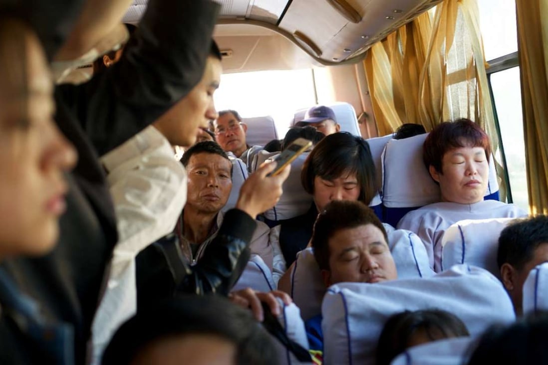 Trapped in a packed bus six hours a day ... the life of a Beijing ...
