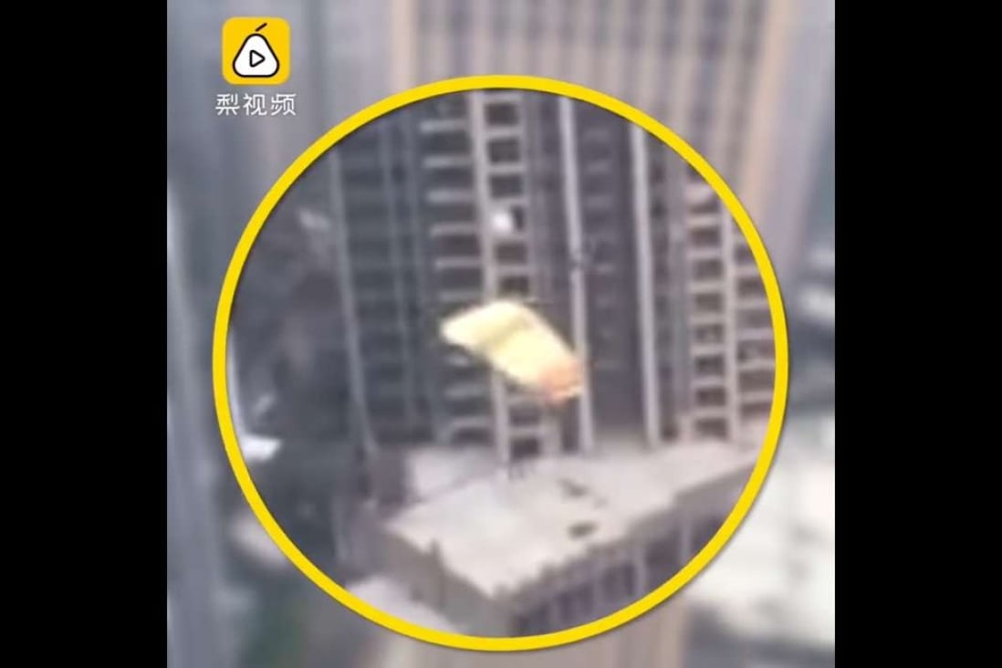 Daredevil jumps from 41-storey building in China ... and lives | South ...