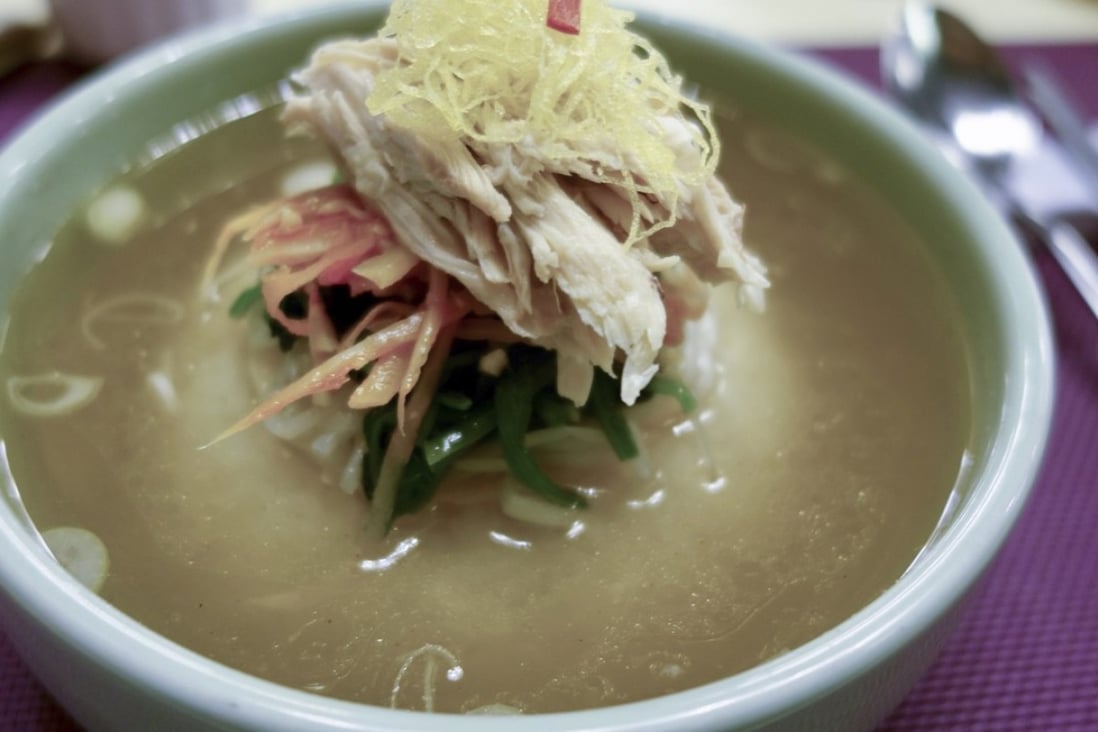 At a North Korean restaurant in Shanghai, fake flowers, fake smiles ...