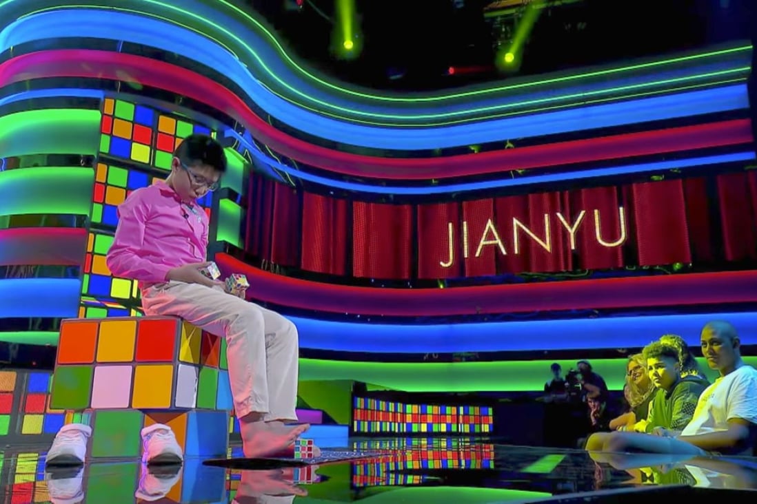 Chinese boy solves 3 Rubik’s cubes at once with both hands – and feet ...