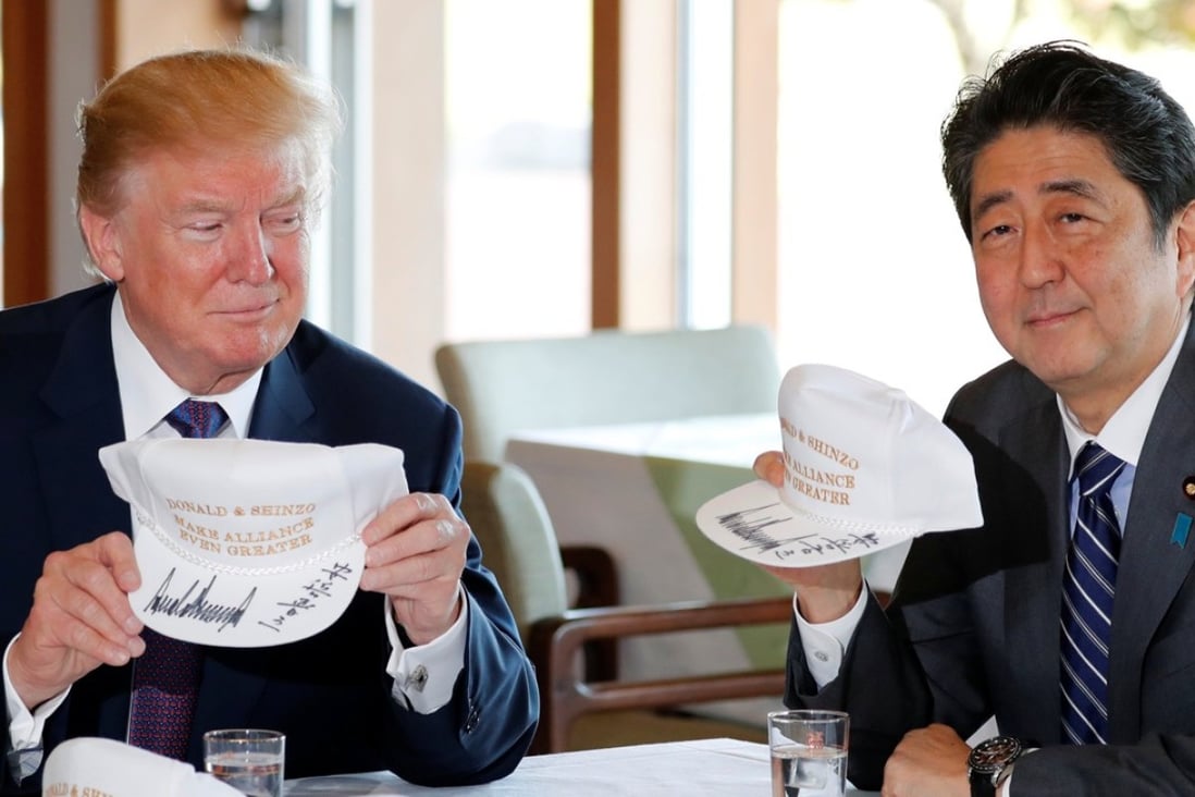 Bromancing over burgers: Abe duels with ‘long hitter’ Donald Trump on ...