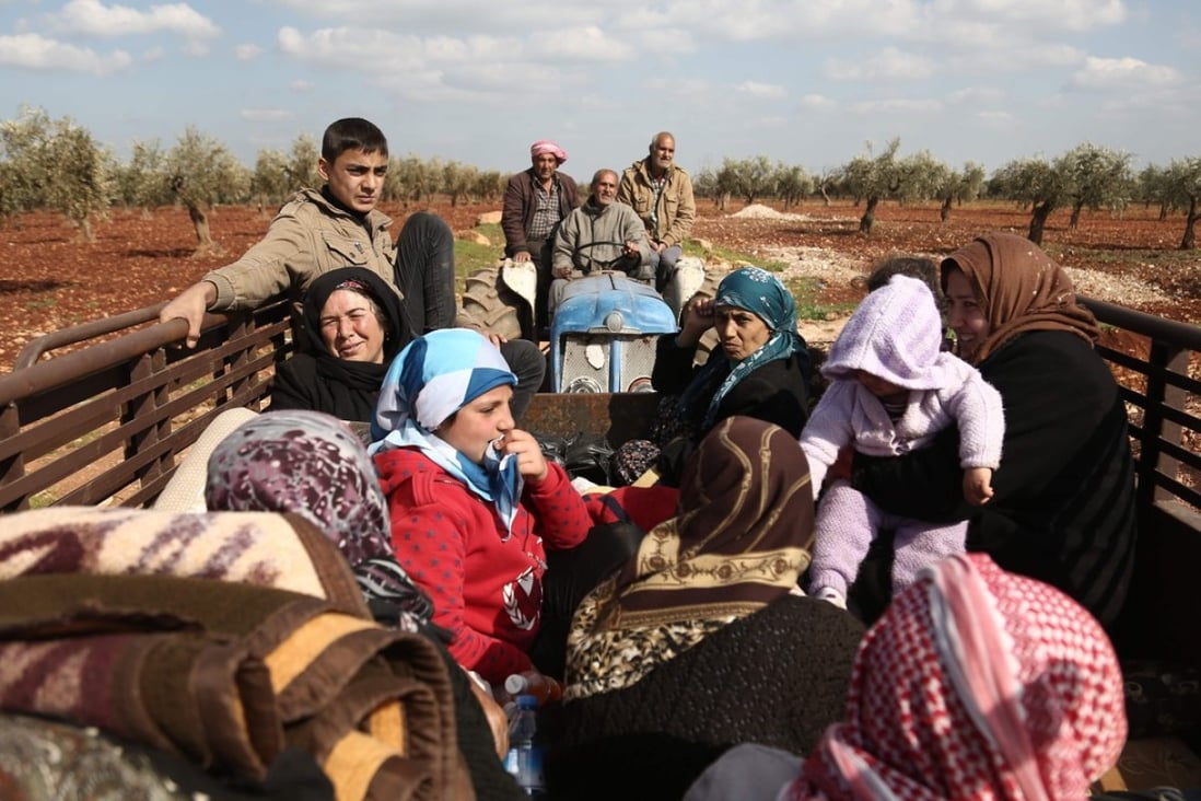 Civilians flee as Turkey says its troops have surrounded Kurdish city ...