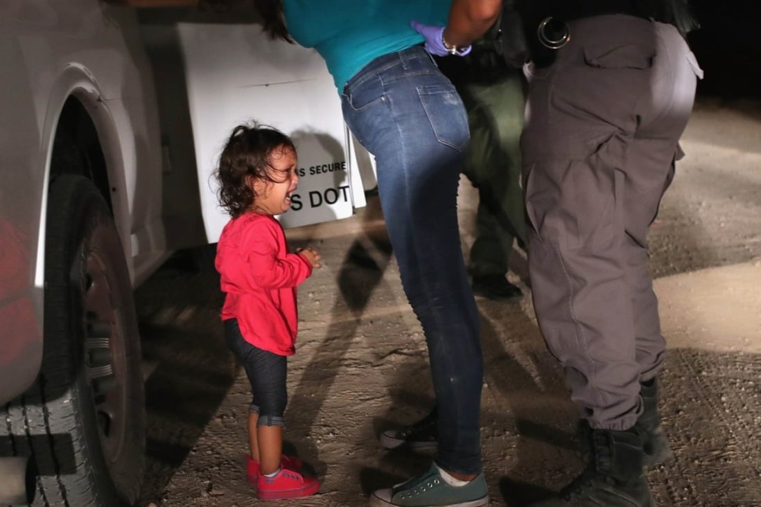 Image of sobbing migrant child at US border breaks hearts around the ...