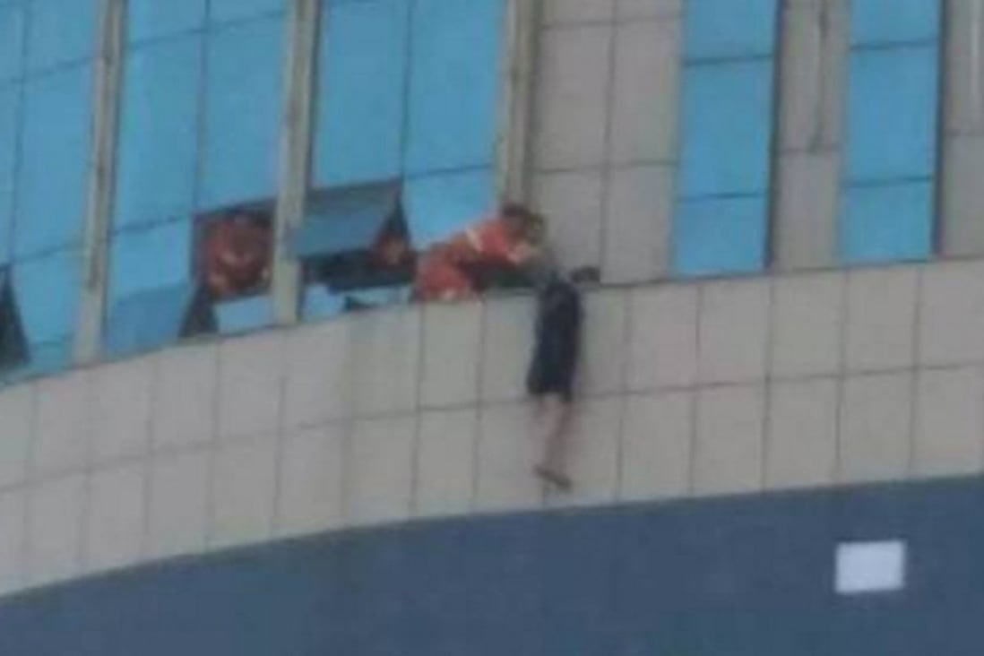 Two Held For Inciting Chinese Woman To Jump To Her Death From Shopping