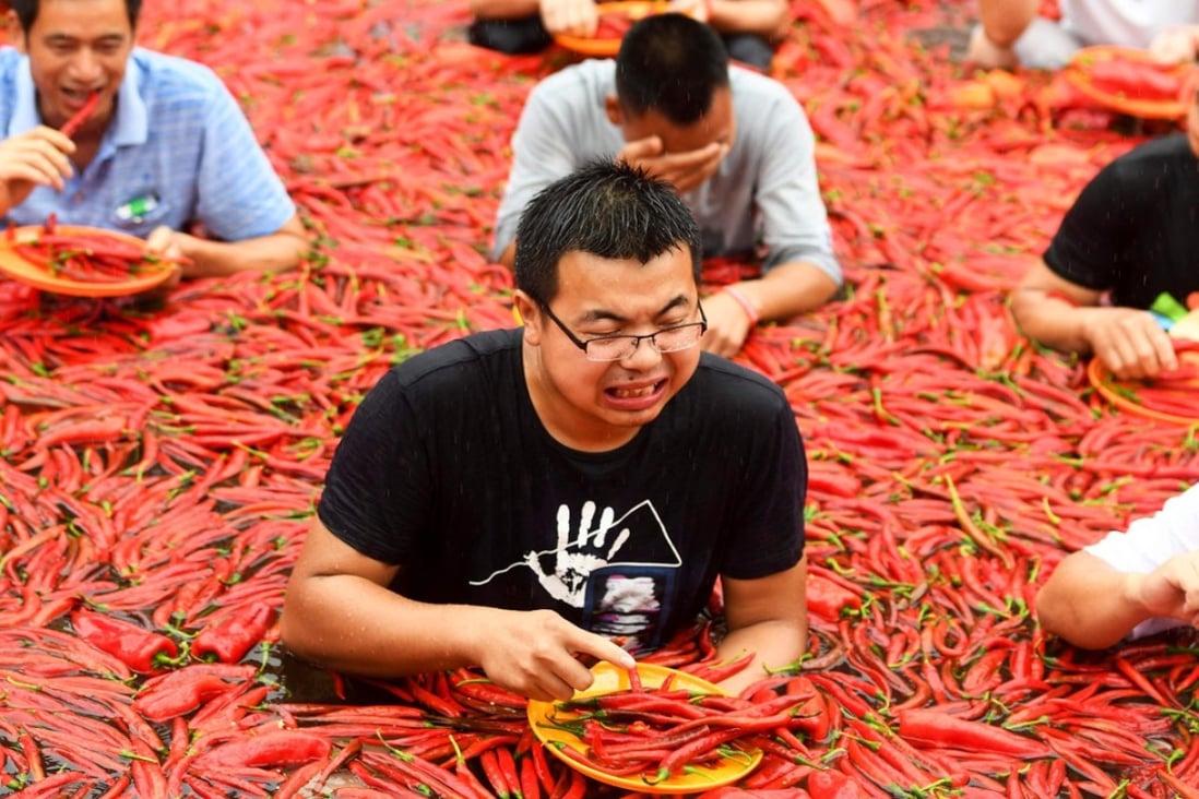 Red hot chilli eater downs 50 peppers in barely a minute at contest in ...