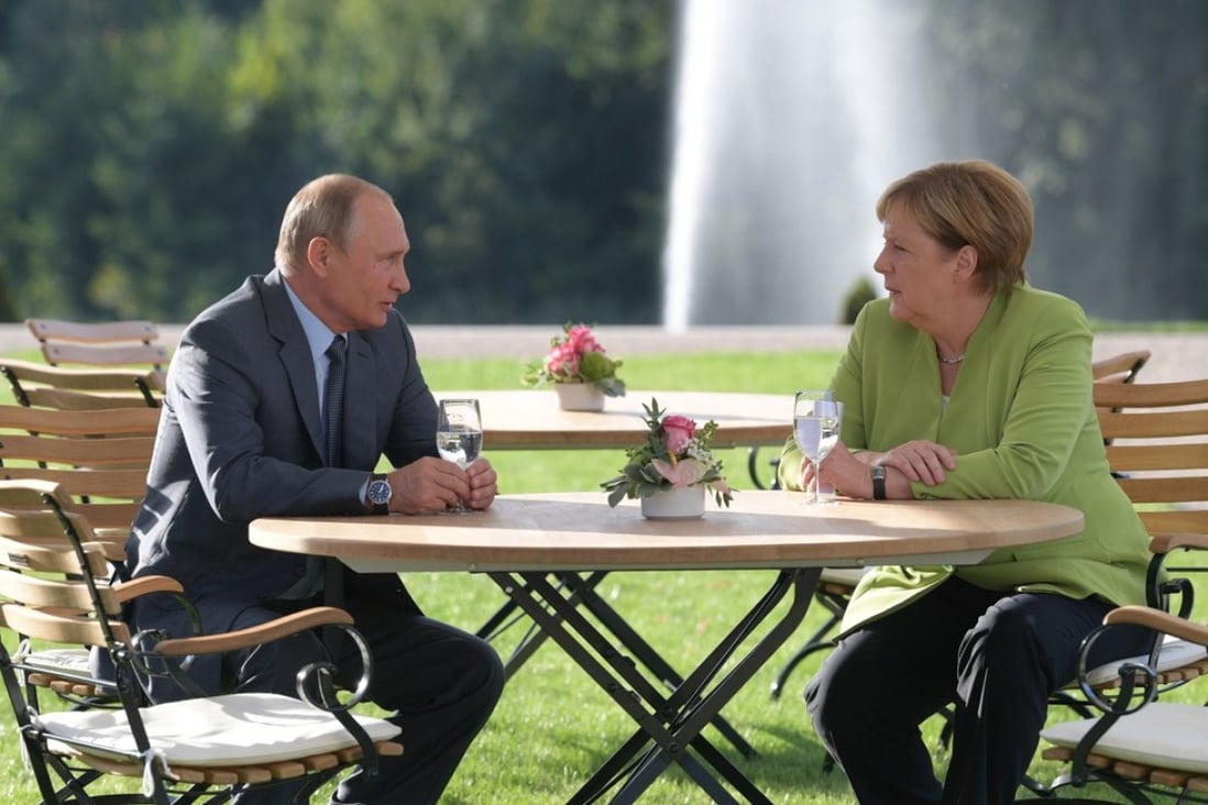 Merkel and Putin tackle tough topics in meeting outside Berlin | South ...