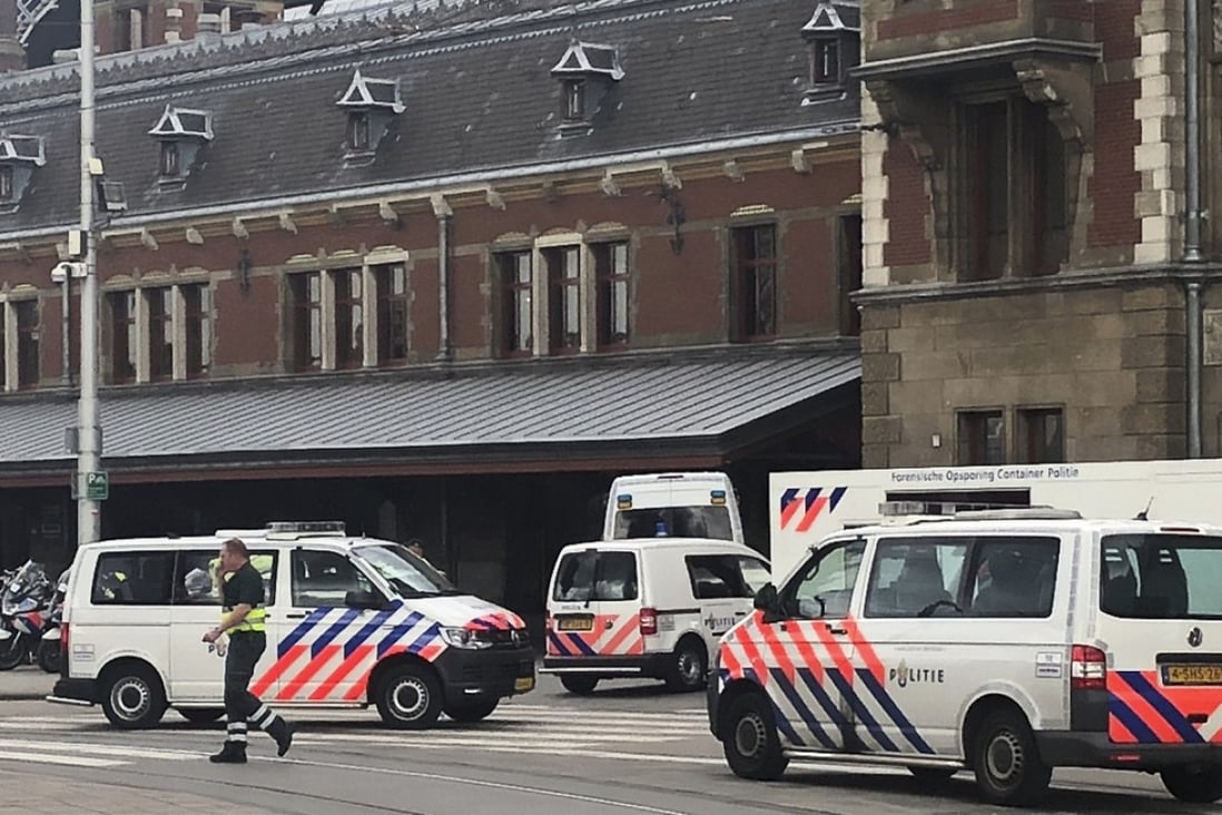 Amsterdam station: attacker shot by police after double stabbing ...