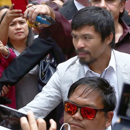 Manny Pacquiao fights off adoring fans in Central ahead of Macau bout ...