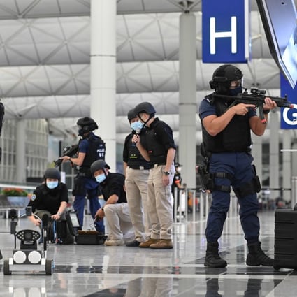 Large-scale counterterrorism drill staged at Hong Kong airport to ...