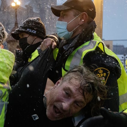 Canada police tow trucks and arrest protesters in bid to break Ottawa ...