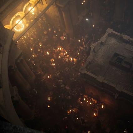 Jerusalem church glows in ‘Holy Fire’ ritual attended by thousands for ...