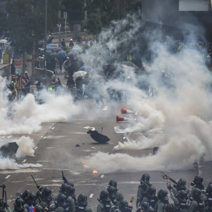 Hong Kong protests: 11 found guilty of rioting near government ...